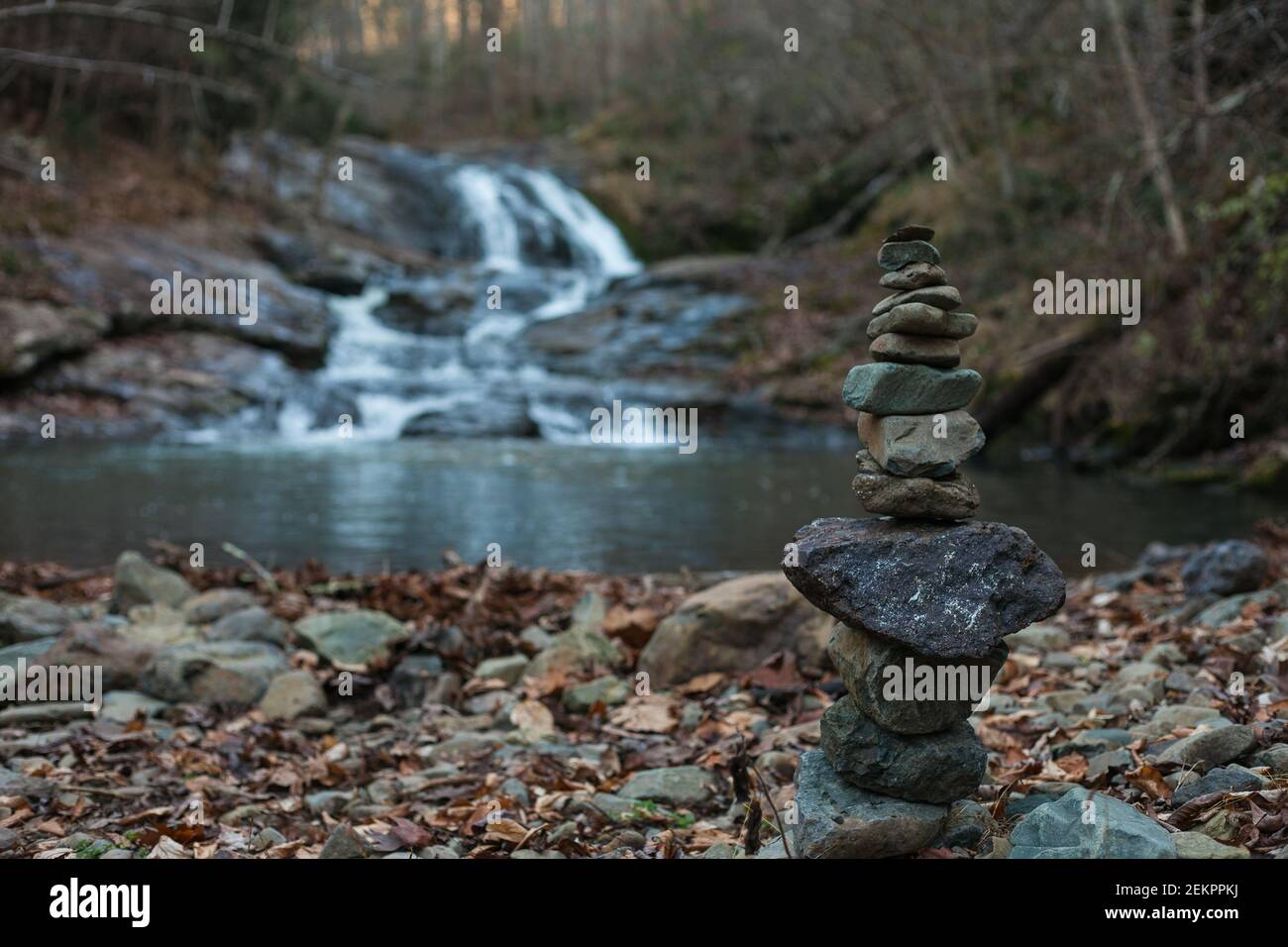 A stack of rocks balance at the base of a waterfall in Virginia Stock ...