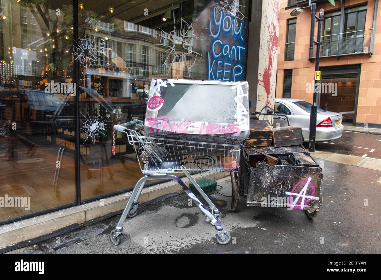 A television at a shopping trolley with the words ‘Fake News’ sprayed ...