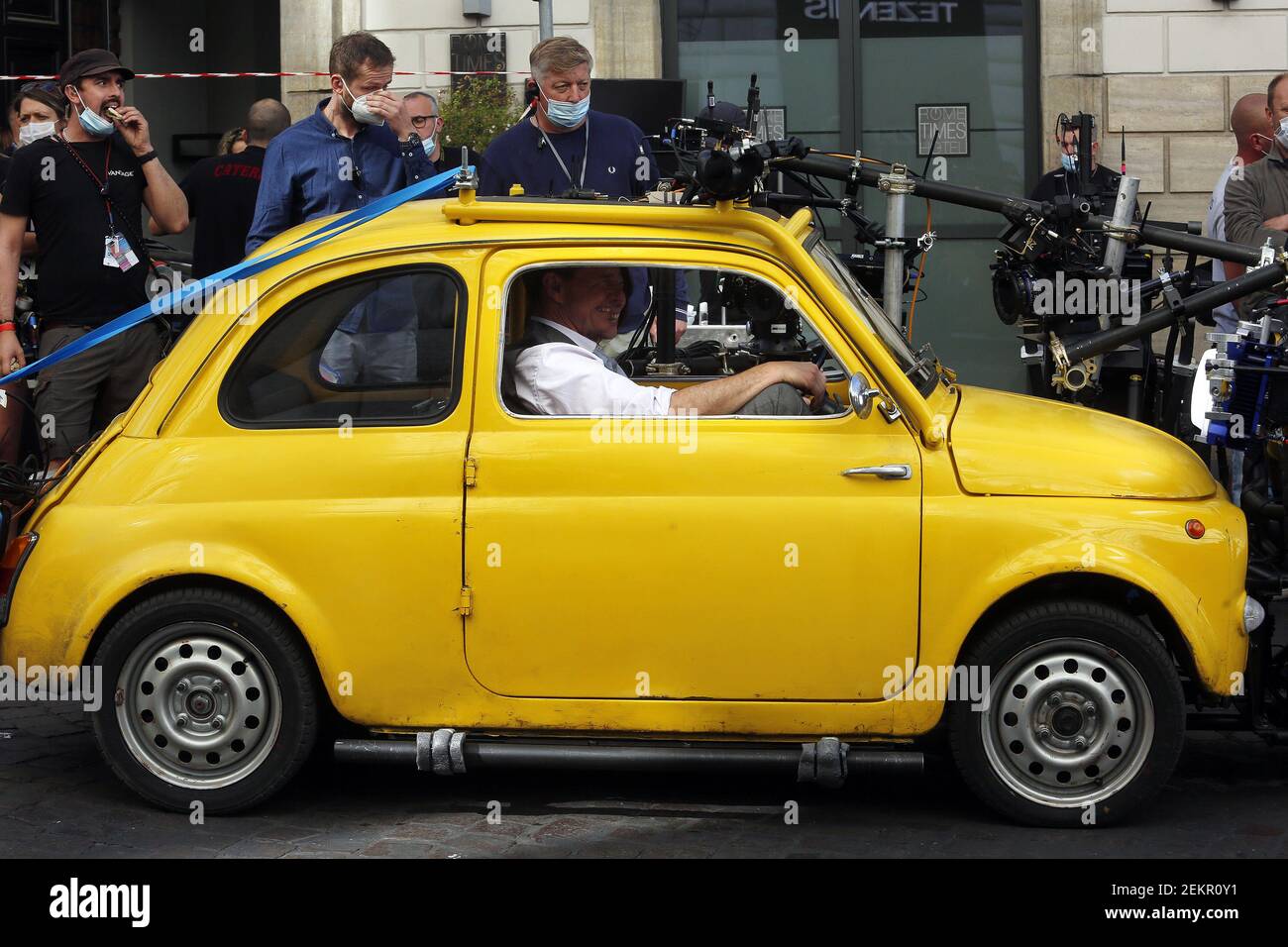 Actor Tom Cruise and actress Hayley Atwell in a yellow Fiat 500 on the ...