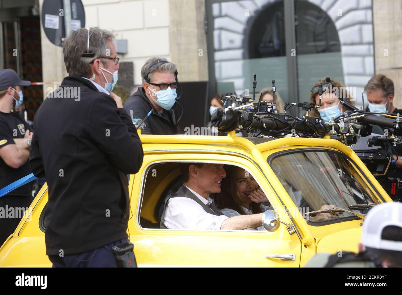 Actor Tom Cruise and actress Hayley Atwell in a yellow Fiat 500 on the ...