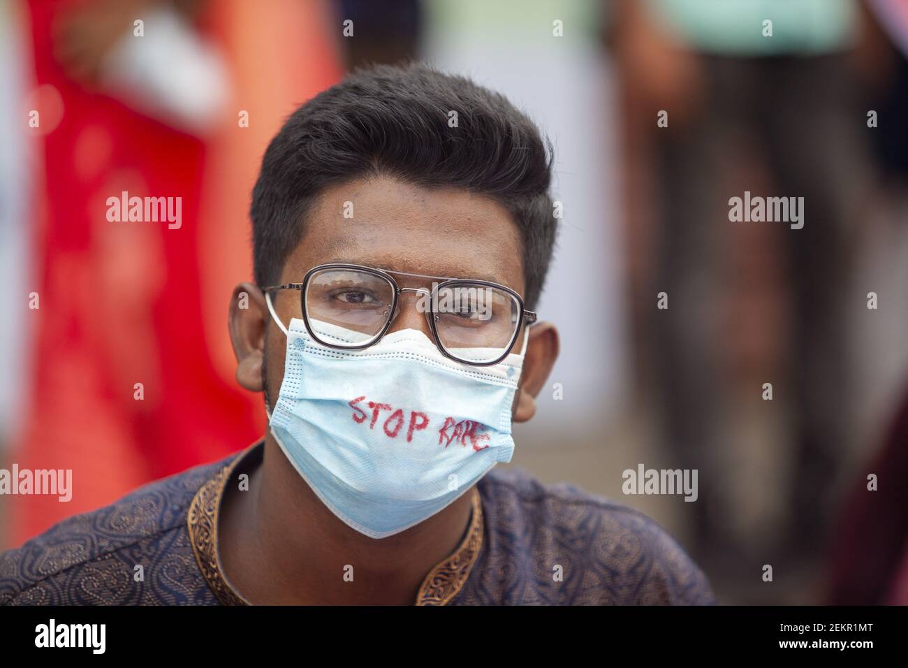 A protester wearing a face mask saying, stop rape, during the ...