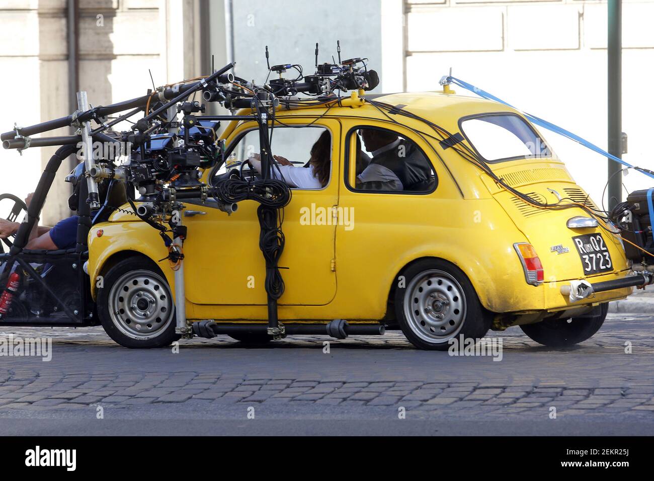 Actor Tom Cruise and actress Hayley Atwell in a yellow Fiat 500 on the ...