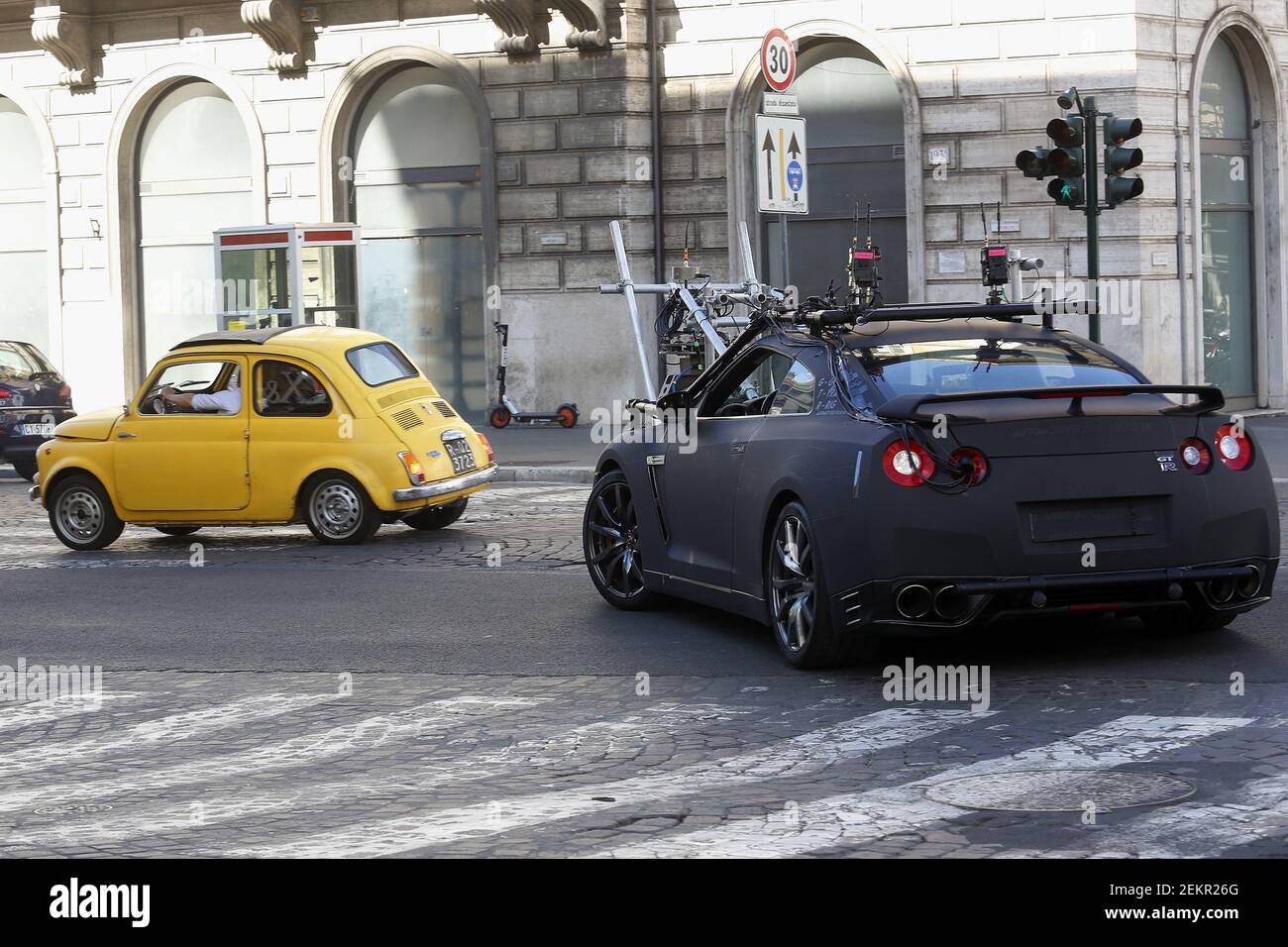 A yellow Fiat 500 car running on the set of the film Mission Impossible ...