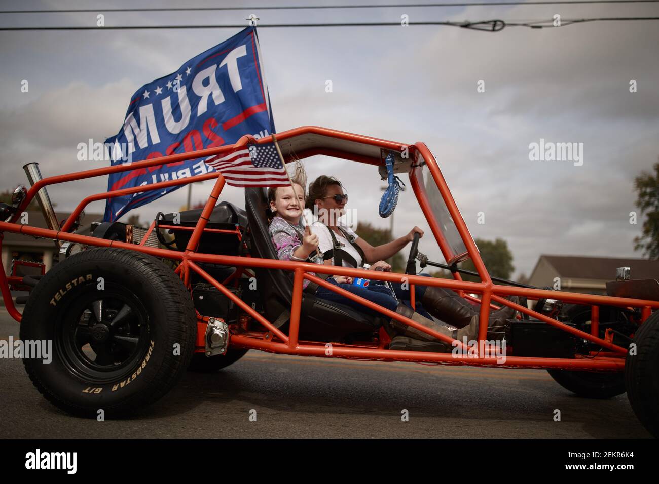 Trump supporters riding a buggy participate in a Donald J. Trump parade ...