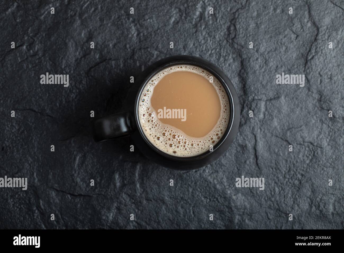 A black cup of coffee on a dark background Stock Photo - Alamy