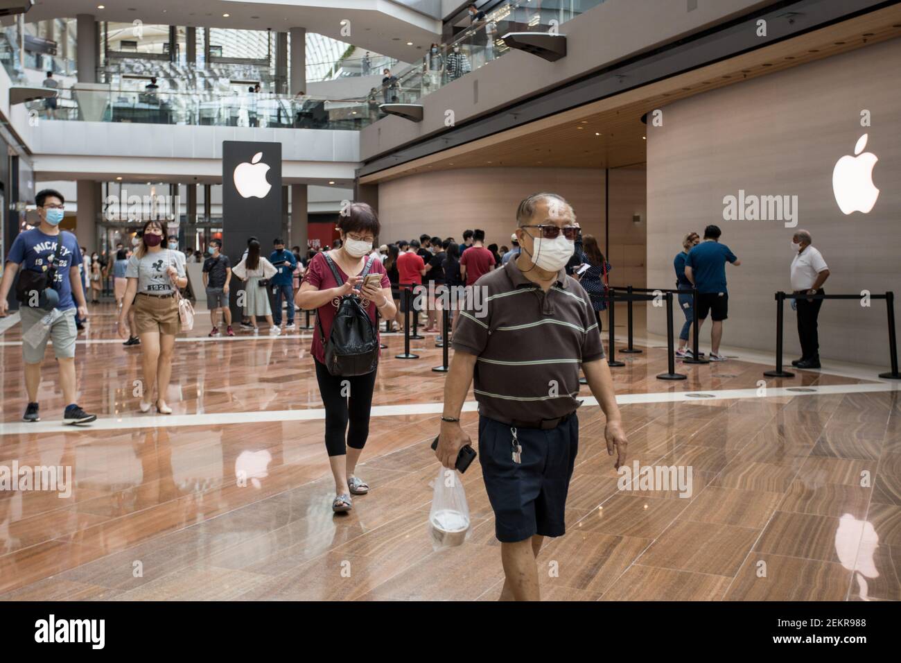 People wearing face masks as a preventive measure seen outside Apple ...