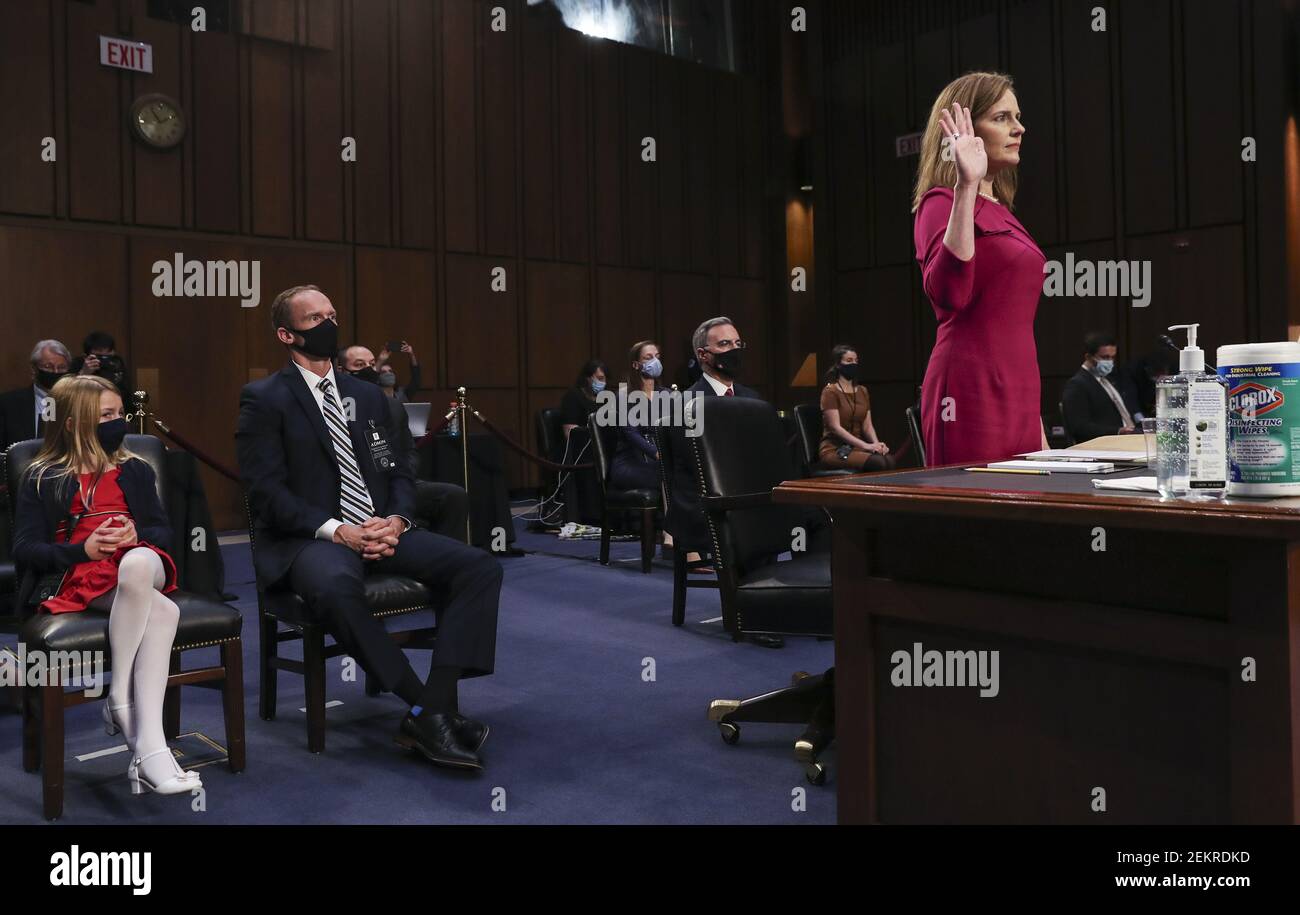 U.S. Supreme Court nominee Judge Amy Coney Barrett is sworn in to ...