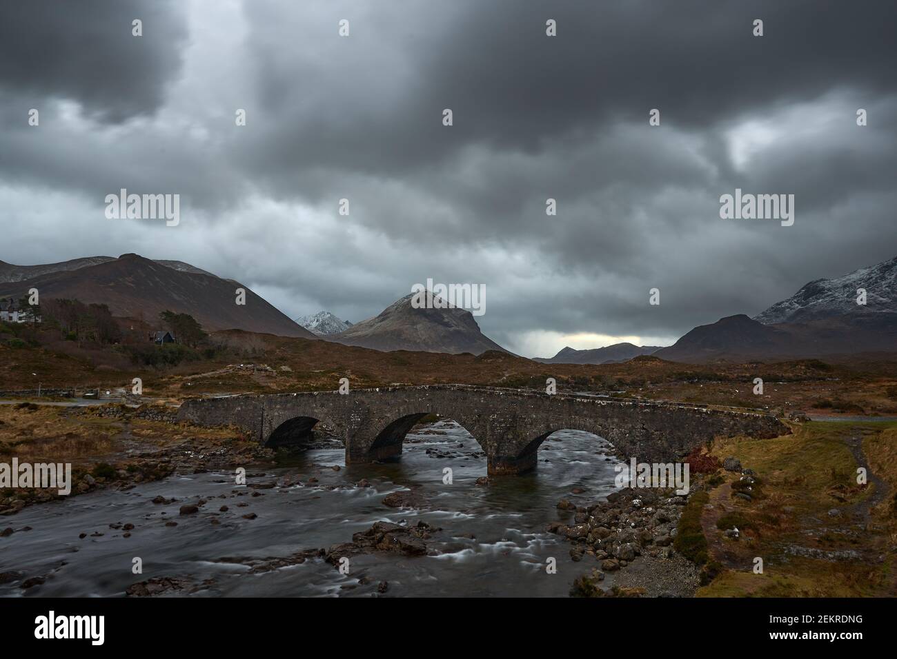 Old three arched stone bridge over the River Sligachan in Isle of Skye ...