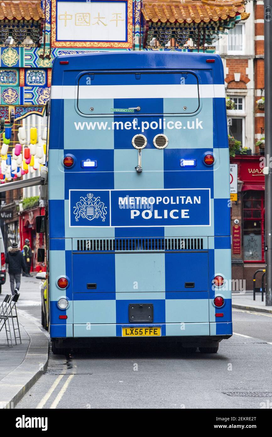 A community bus from the Metropolitan Police is parked in Chinatown ...