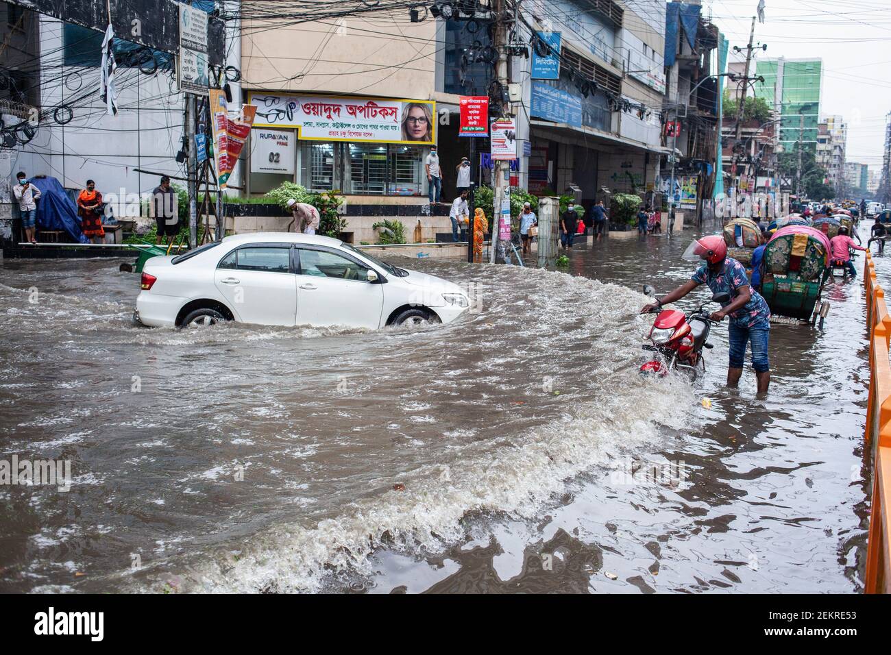 A vehicle makes it through the waterlogged Green Road after heavy rains ...