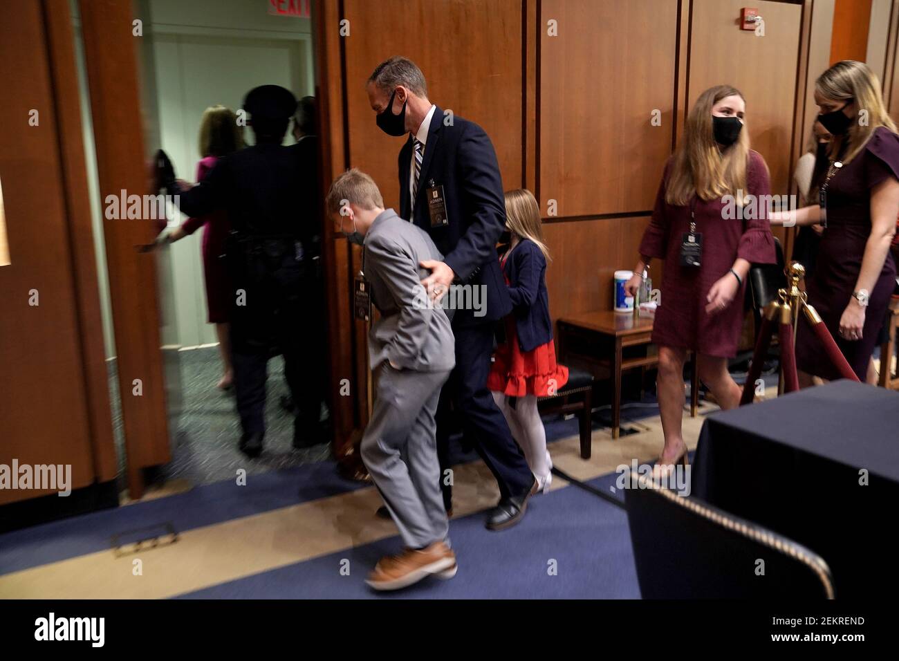 Jesse Barrett leaves with his family after the first day of President ...