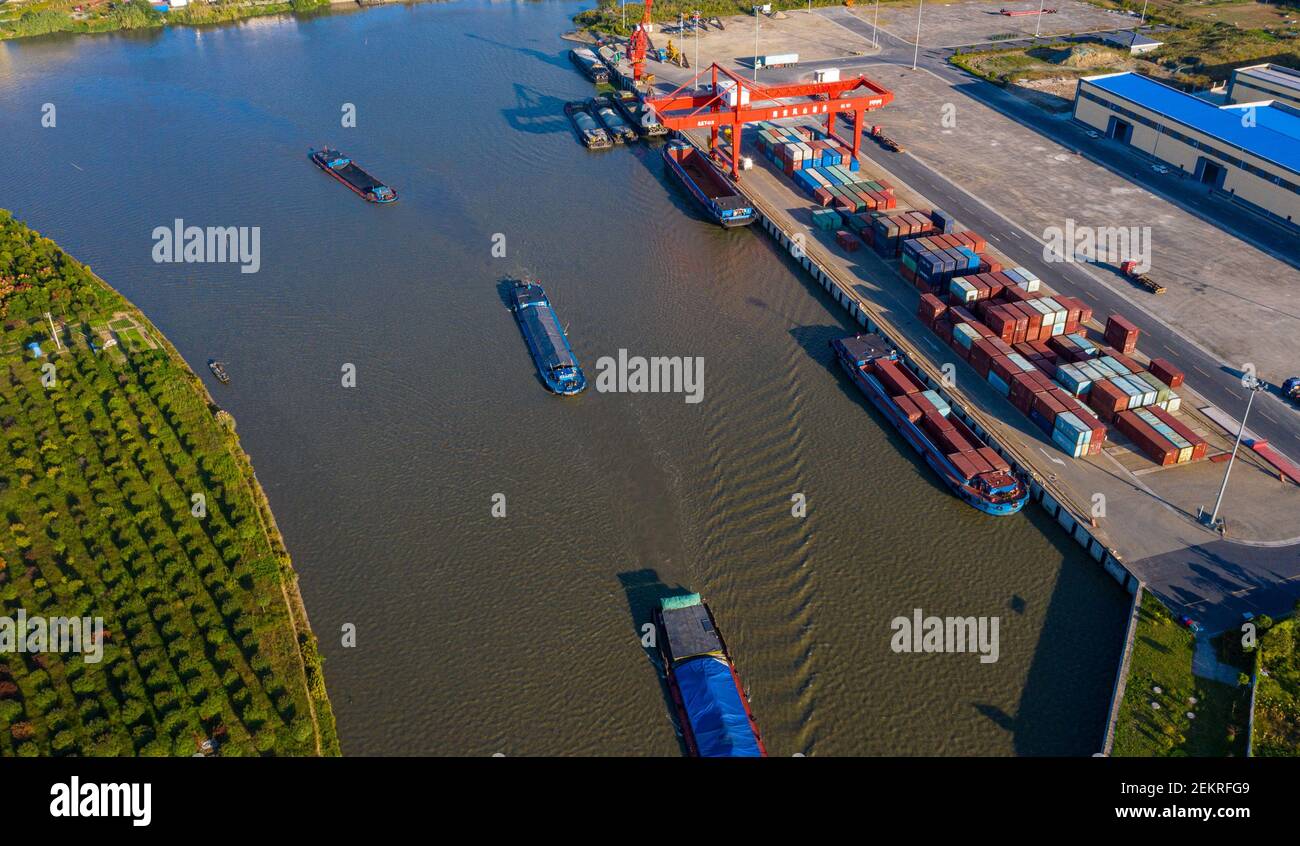 HAI'AN, CHINA - OCTOBER 13, 2020 - Workers lift containers onto cargo ...