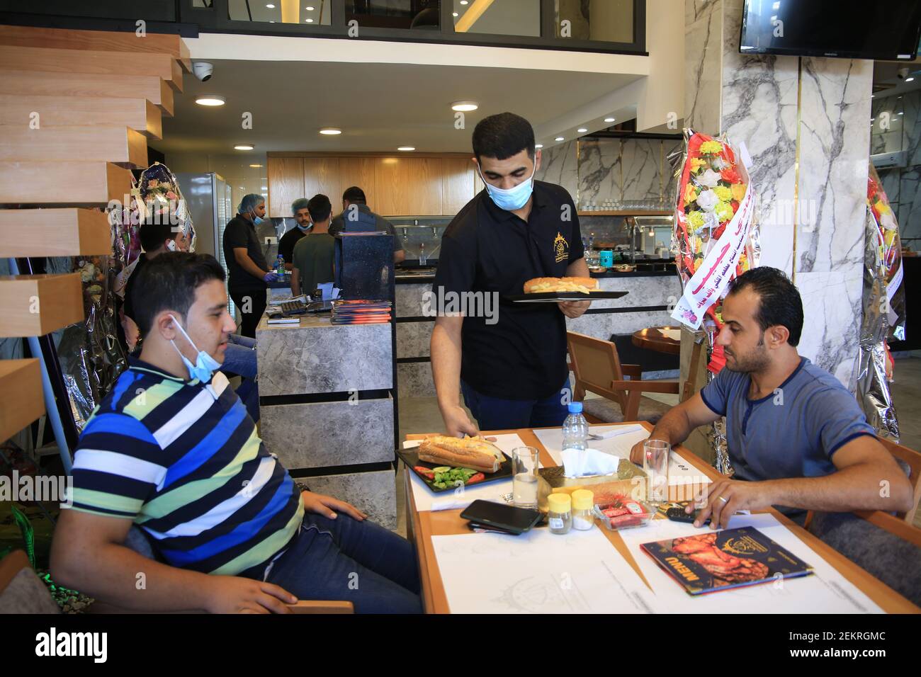 A Palestinian while enjoy their time at a restaurants, in Gaza City ...