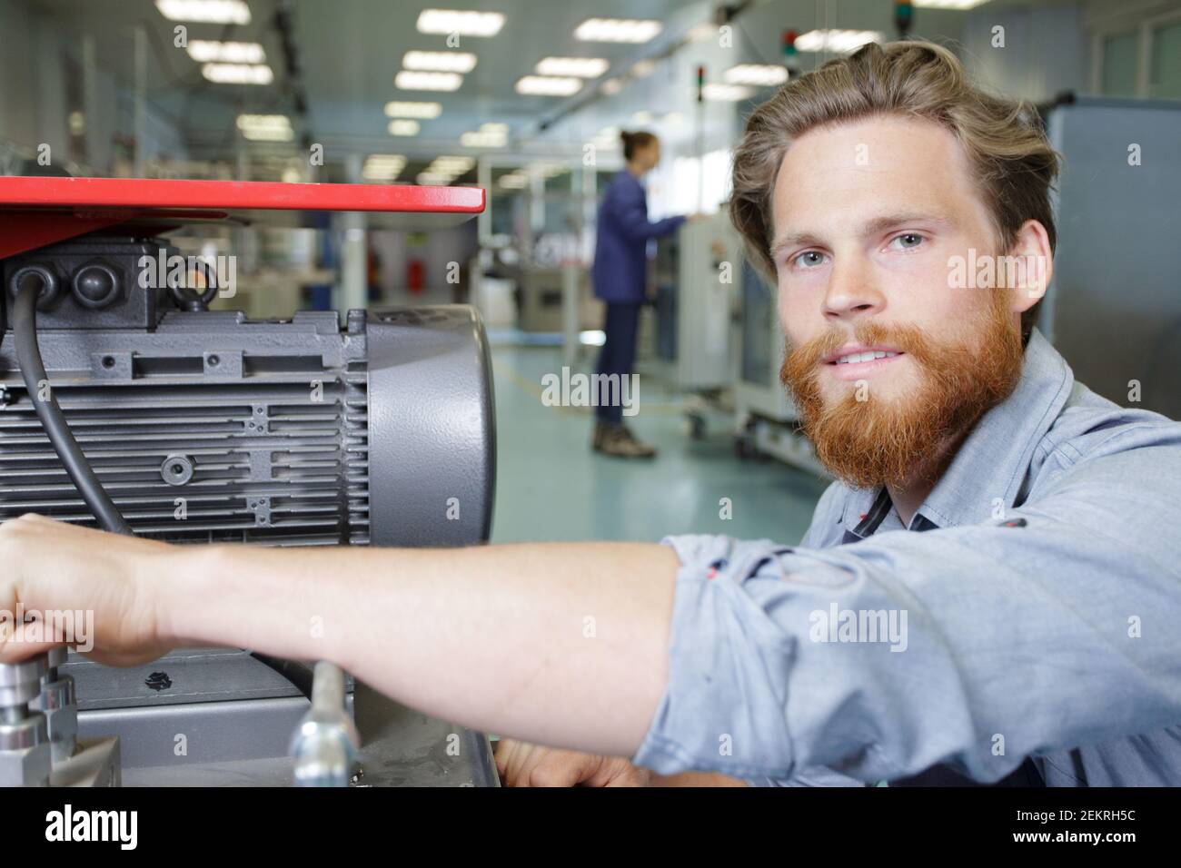 mechanical engineer checking machine in factory Stock Photo - Alamy