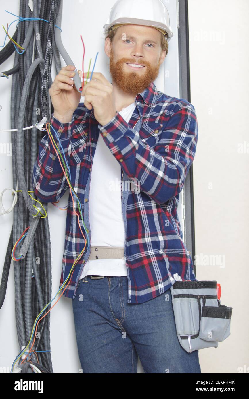 a worker is holding cables Stock Photo - Alamy
