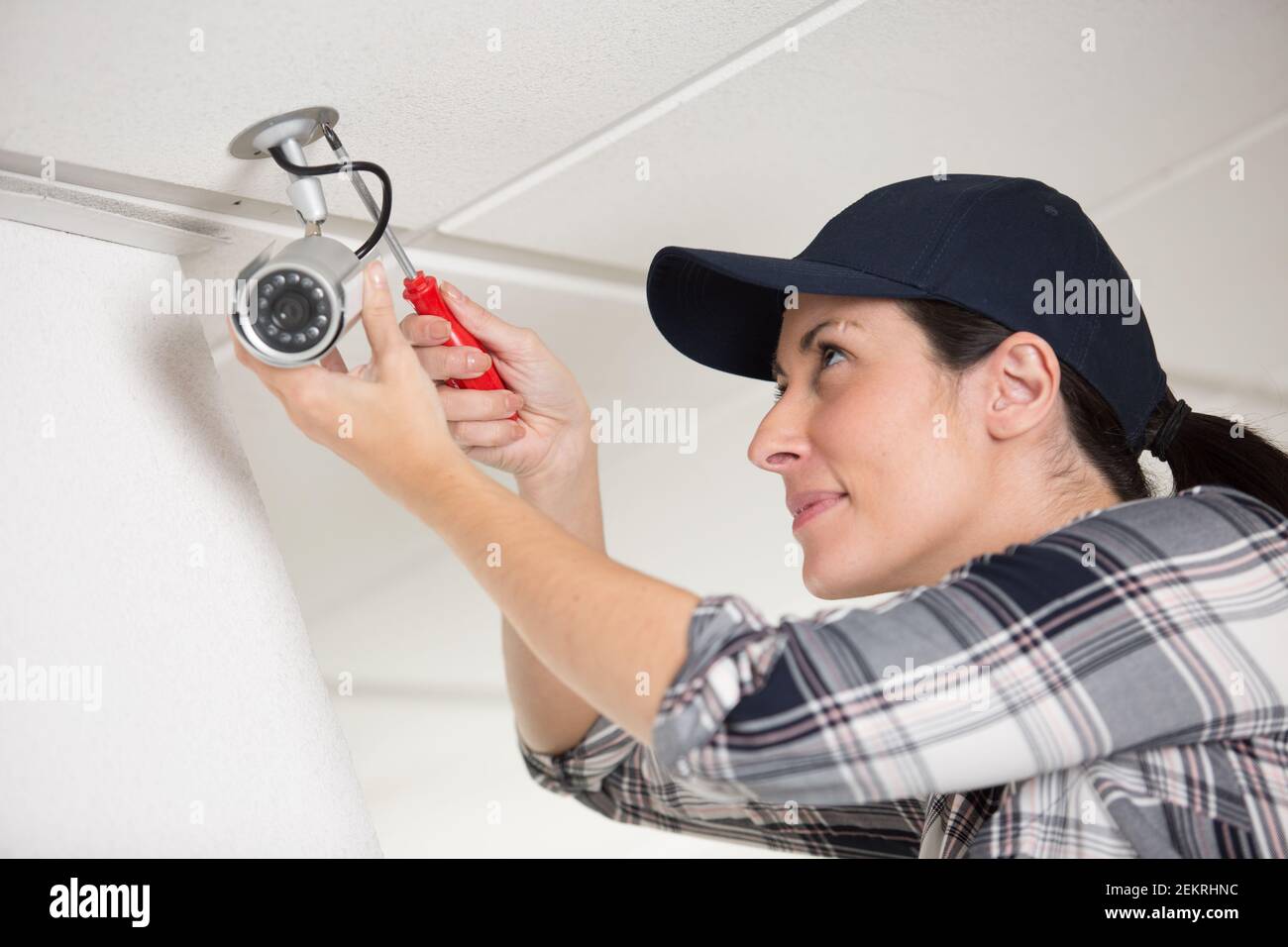 female professional cctv technician working Stock Photo - Alamy