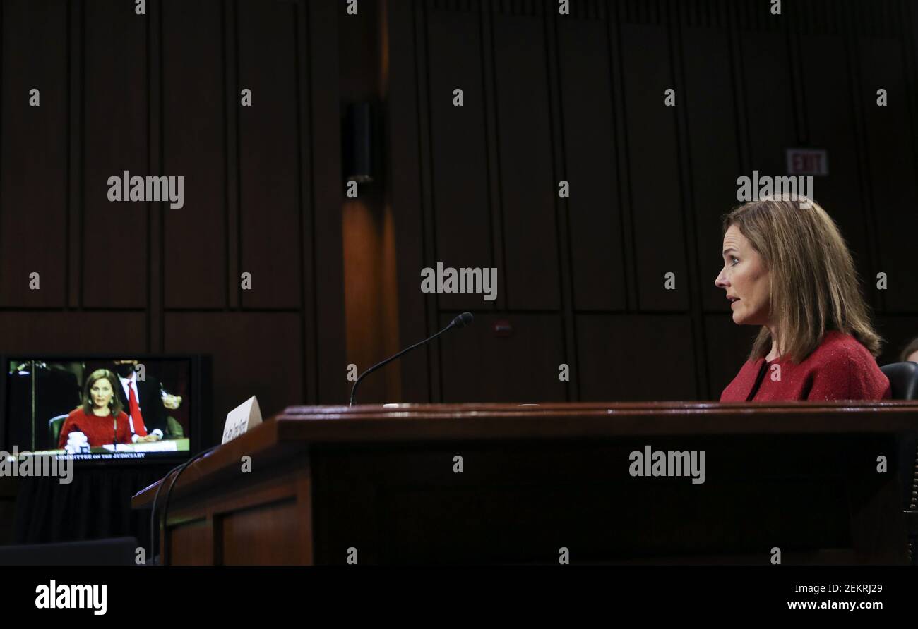 U.S. Supreme Court nominee Judge Amy Coney Barrett is seen on a TV ...