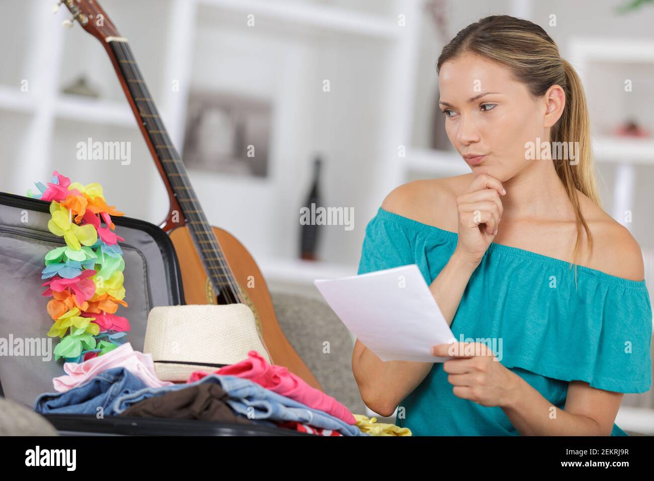 Woman packing suitcase sad hi-res stock photography and images - Alamy