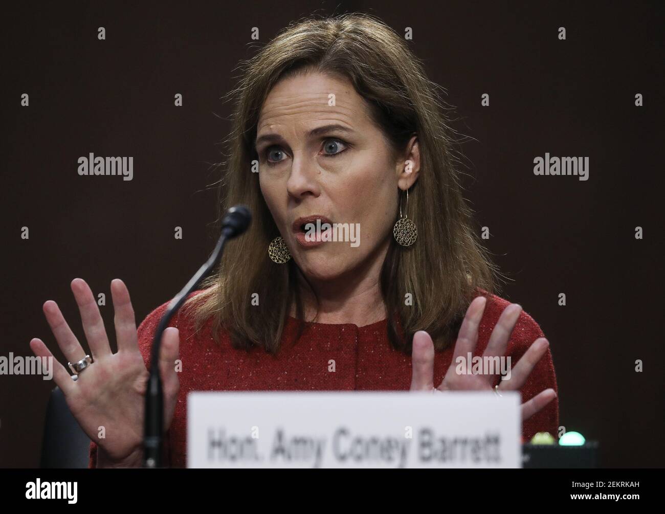 U.S. Supreme Court nominee Judge Amy Coney Barrett reacts as she ...