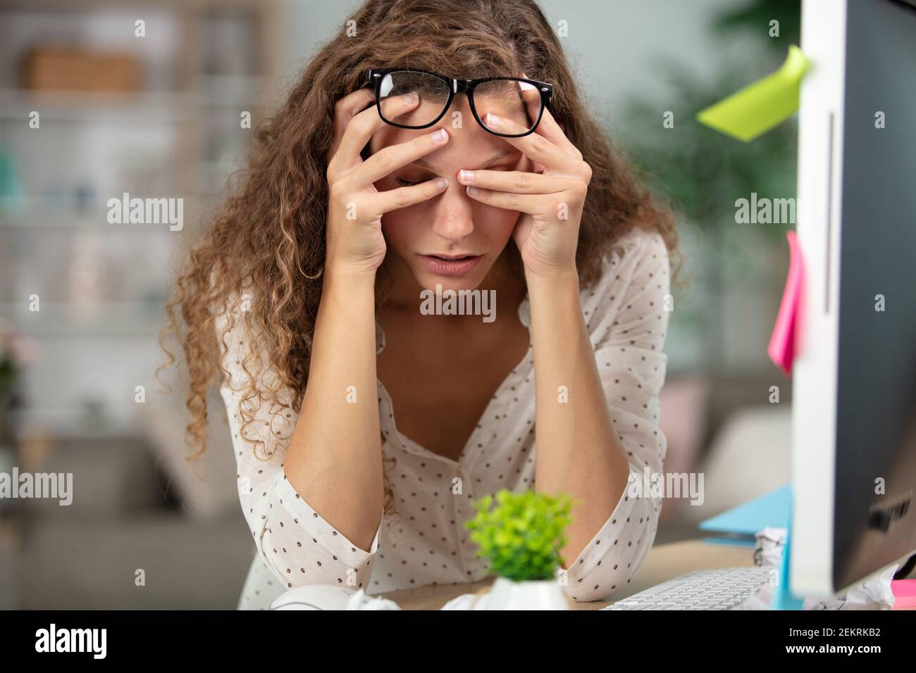 female office worker is tired of work and exhausted Stock Photo - Alamy