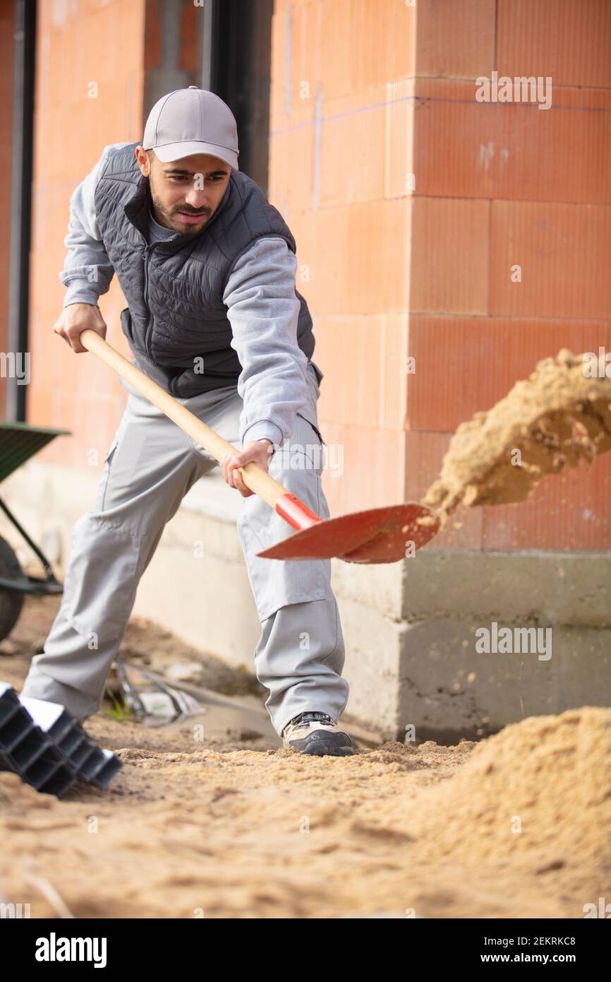 image of worker on a house construction Stock Photo - Alamy