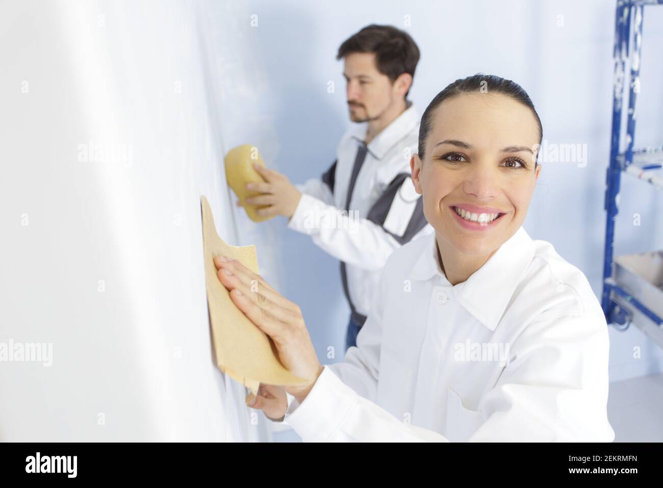 Happy female plasterer hi-res stock photography and images - Alamy