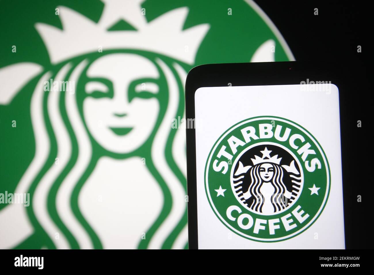 In this photo illustration, Starbucks logo is seen displayed on a ...