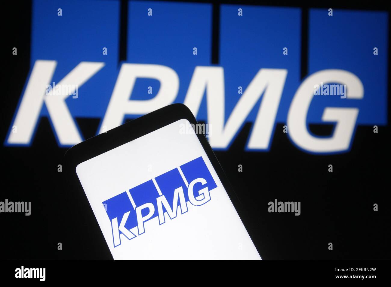 In this photo illustration, KPMG logo of a multinational professional ...