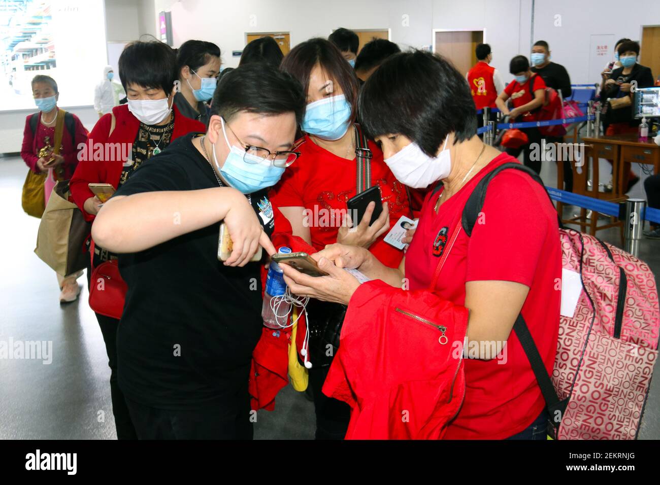 ZHOUSHAN, CHINA - OCTOBER 14, 2020 - A passenger learns how to use a ...