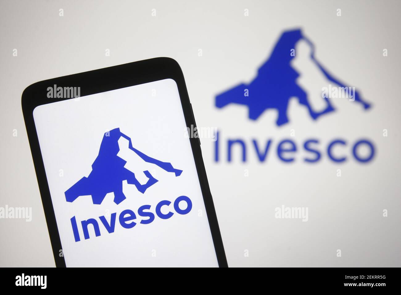 In this photo illustration, Invesco logo is seen displayed on a ...