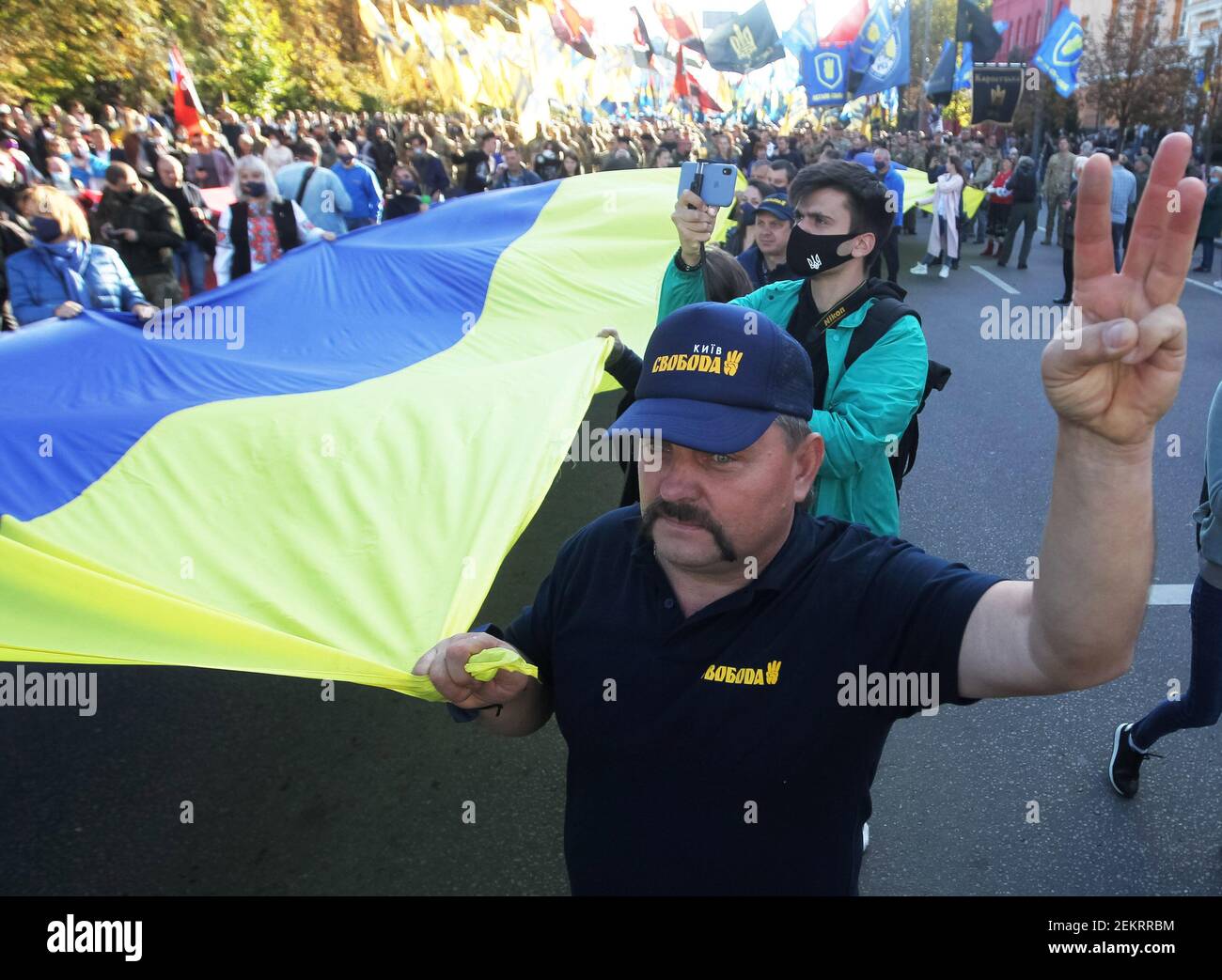 Ukrainian far-right activists hold a large Ukrainian flag during the ...