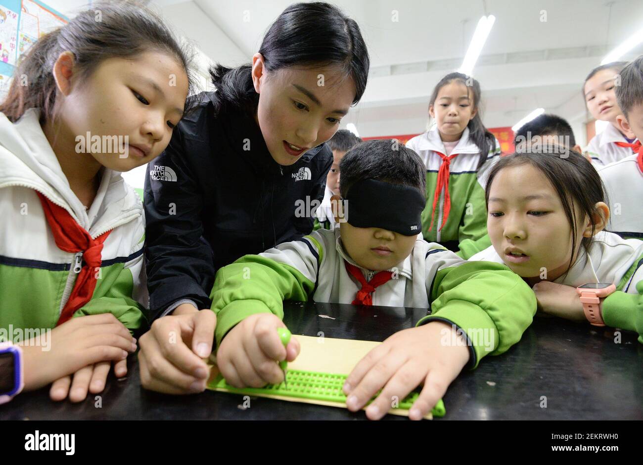 Primary school kids blindfold themselves as part of a blindness ...