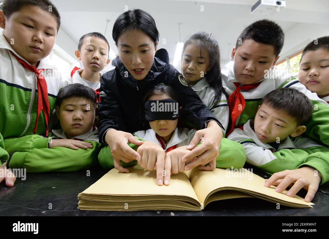 Primary school kids blindfold themselves as part of a blindness ...