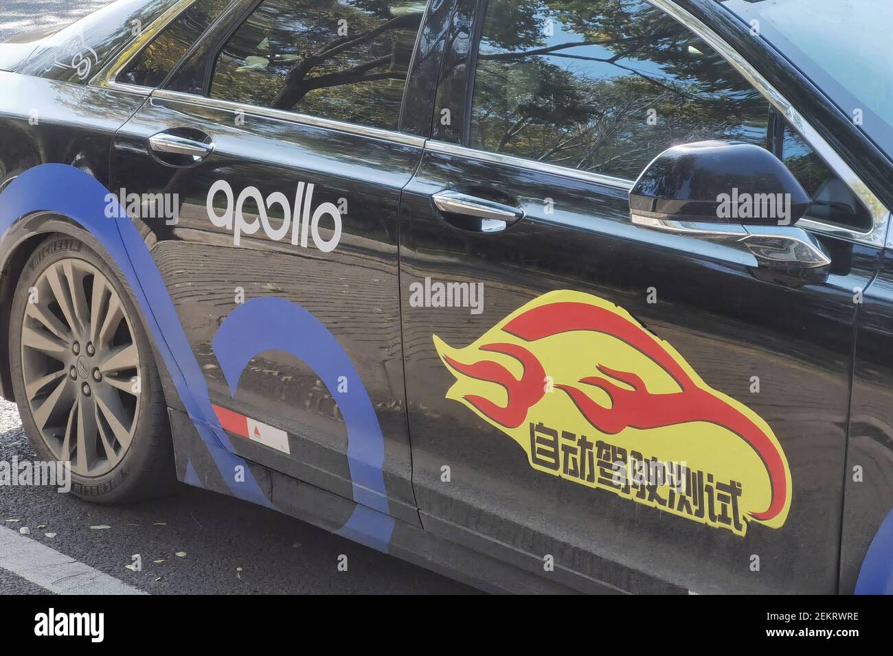 An Apollo Go Robotaxi drives on a road in Beijing, China, 14 OCtober ...