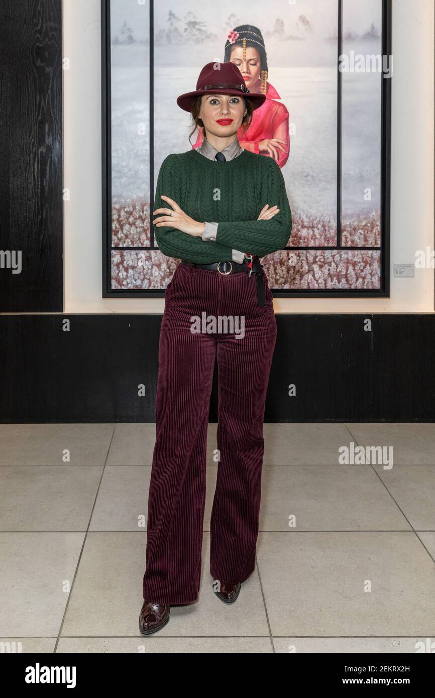 Mila Alexander poses infront of her painting during her solo art ...