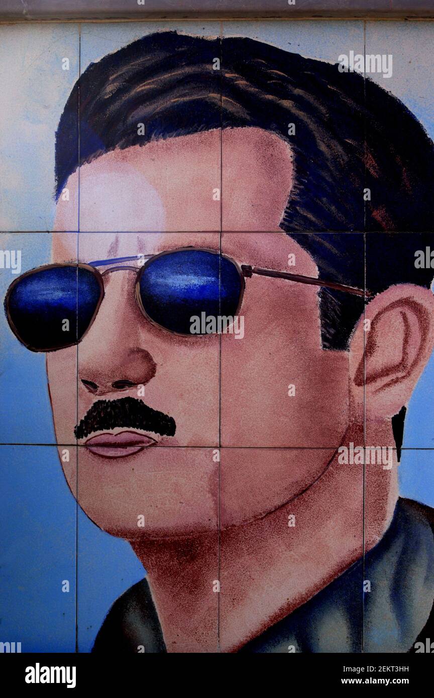 A mural of Bashar Al Assad the Syrian president at a roadside cafe in ...