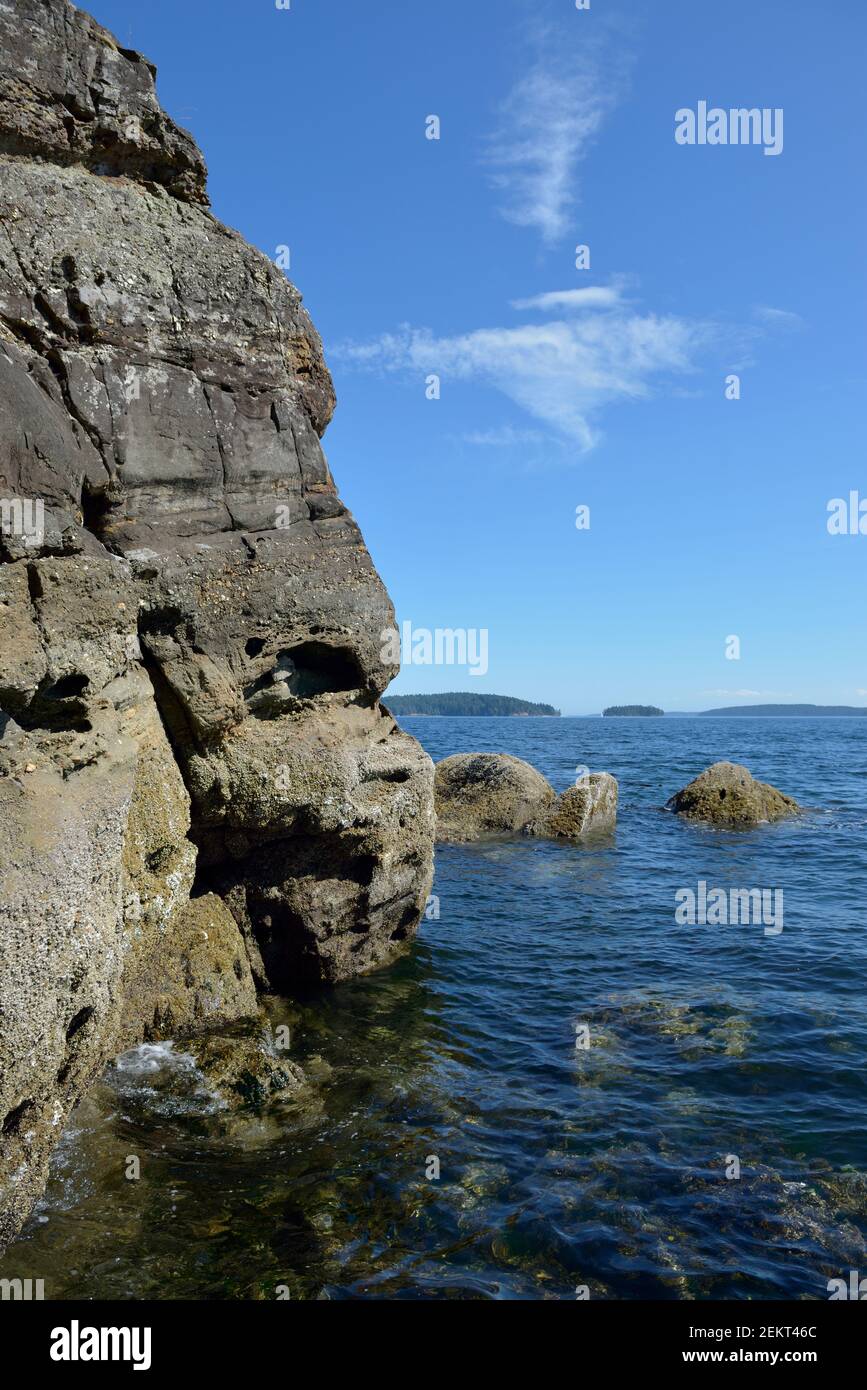Tall cliffs on the south side of Russell Island, British Columbia ...