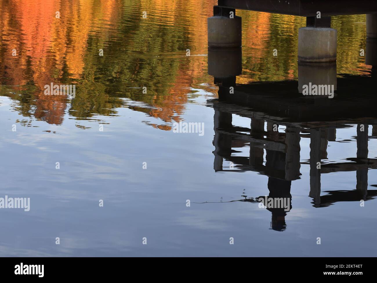 A fisherman is reflected in Lake Frances at Frances Slocum State Park ...