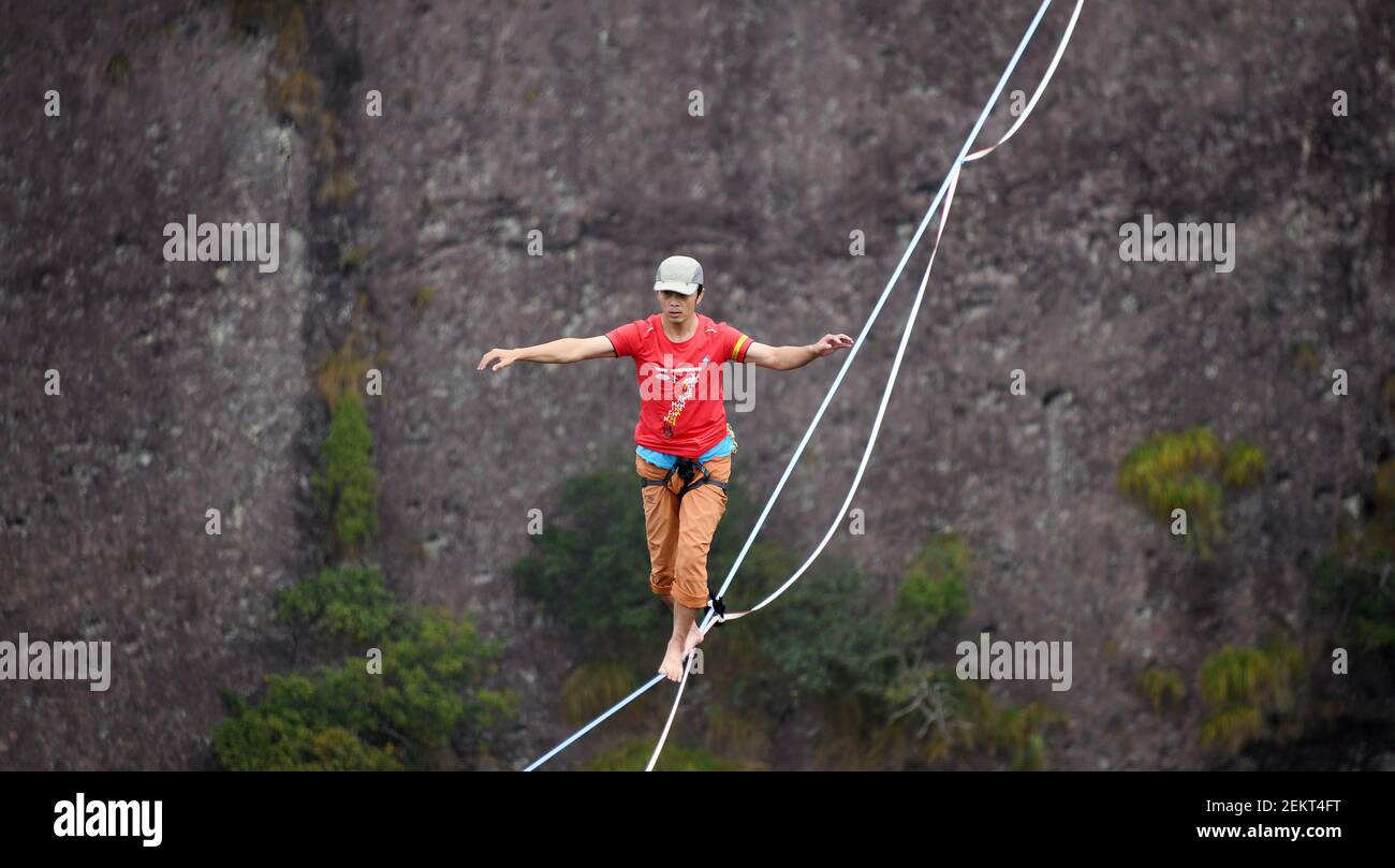A slacking participant walks on a tight rope in the air at the 2020 ...