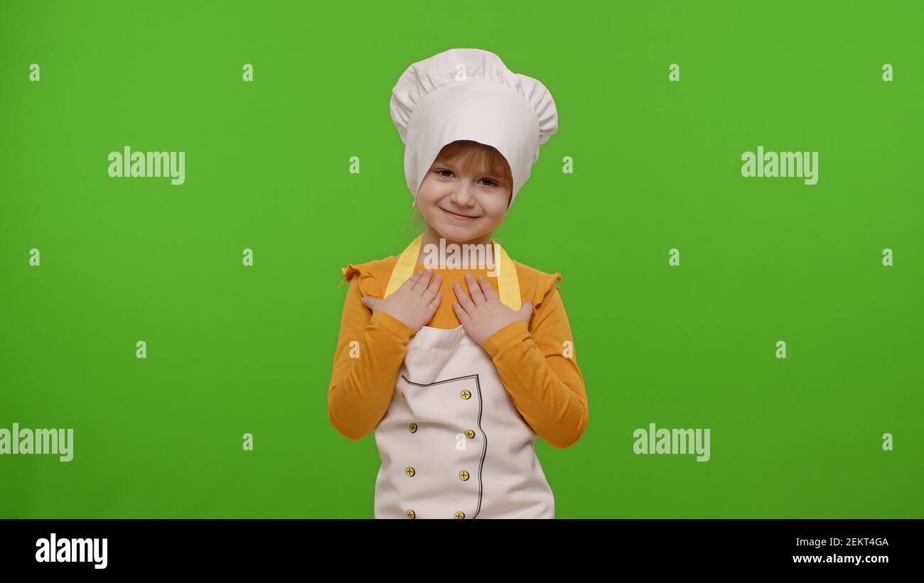 Child girl kid dressed as professional cook chef showing thumbs up ...