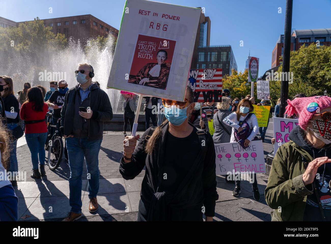 A protester holds a placard expressing her opinion at Washington Square ...