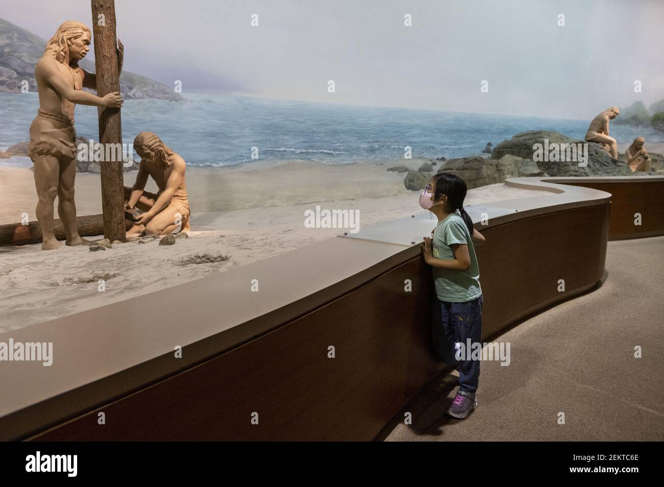 A child visitor looks at a Neolithic-themed scene at the Hong Kong ...
