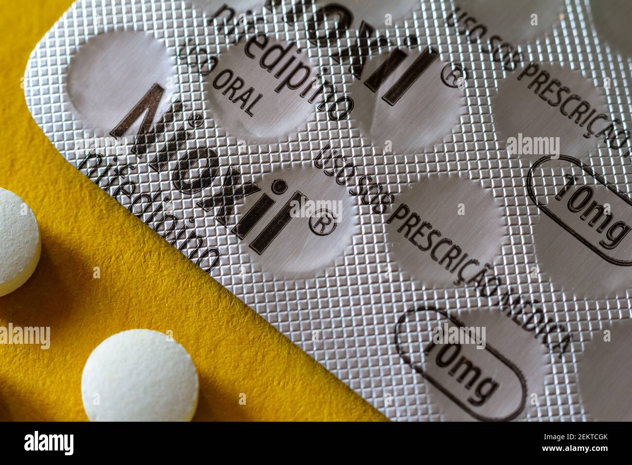 In this photo illustration a pack of Nioxil (Nifedipino) with some ...