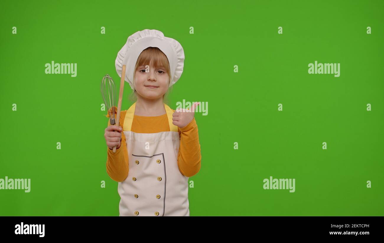 Child girl kid as professional cook chef baker posing, smiling, looking ...
