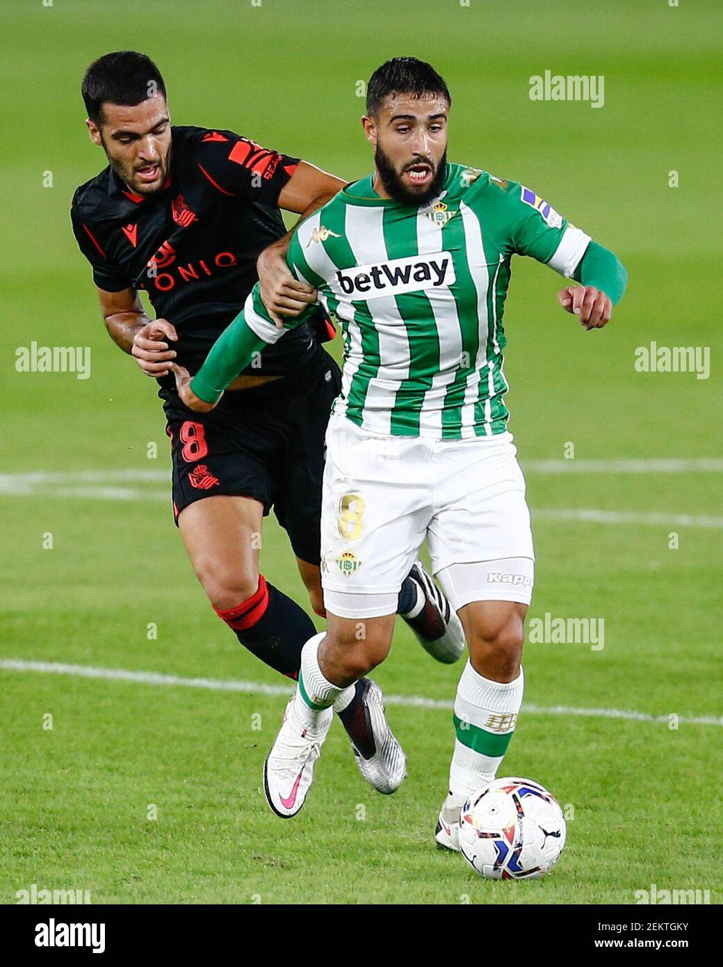 Nabil Fekir of Real Betis and Mikel Merino of Real Sociedad during the ...