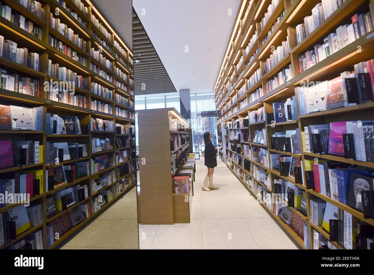 HANGZHOU, CHINA - OCTOBER 18, 2020 - A reader shops at Daikanyama T ...