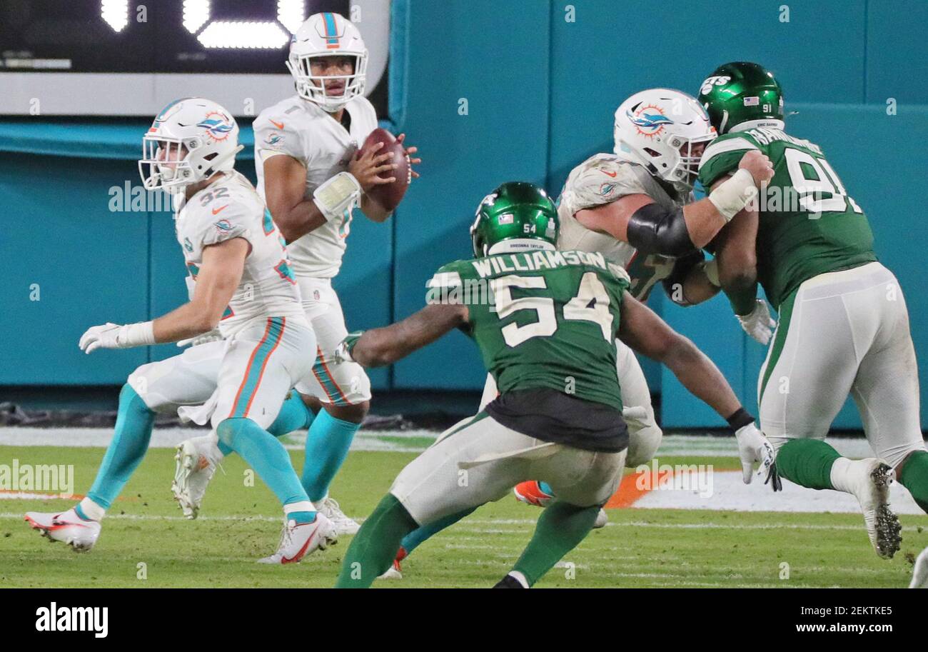 Miami Dolphins quarterback Tua Tagovailoa (1) sets up to pass in the fourth quarter against the ...