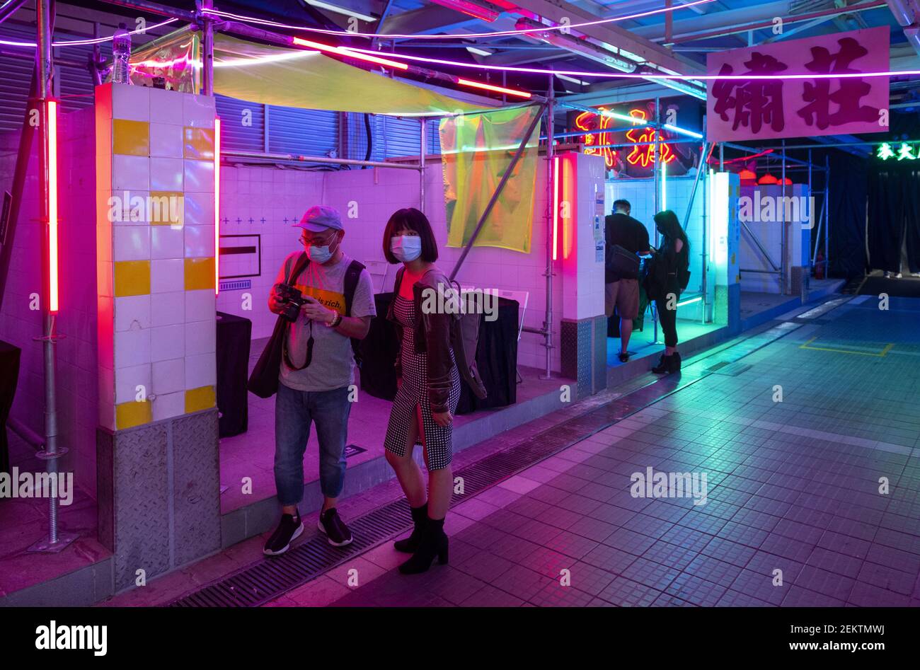 Visitors take photos at an exhibition called 'Heart of Cyberpunk'. The ...