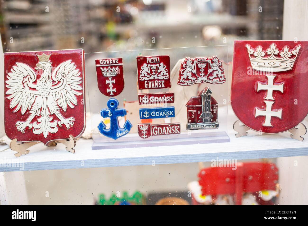 Emblem of Poland and emblems of Gdansk are seen at the souvenire store ...