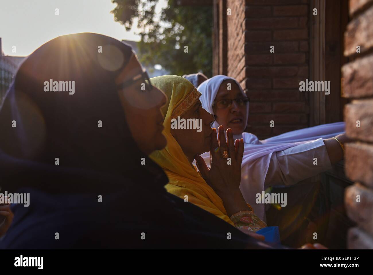 Kashmiri Muslims outside the shrine during the mass prayers. Thousands of Muslims gathered at ...